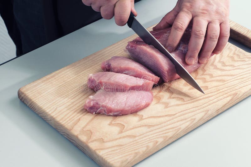 Man Preparing Raw Meat at the Butchers Stock Photo - Image of meat ...