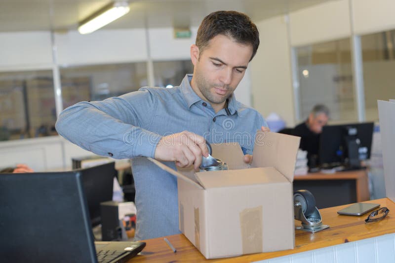 Man Preparing Roll Cages for Delivery Stock Image - Image of manager ...