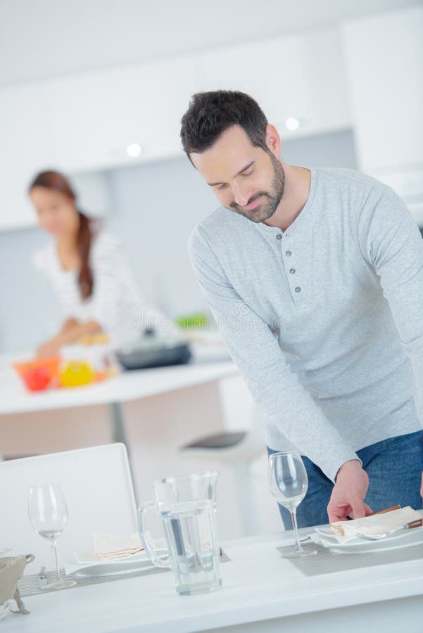 Man preparing table stock image. Image of organize, apartment - 248310259