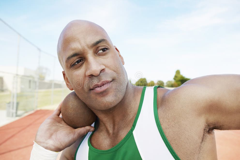 Man Preparing To Toss Shot Put Stock Photo - Image of confidence ...