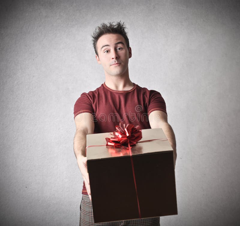 Man with a present stock image. Image of happy, astonishment - 37014087