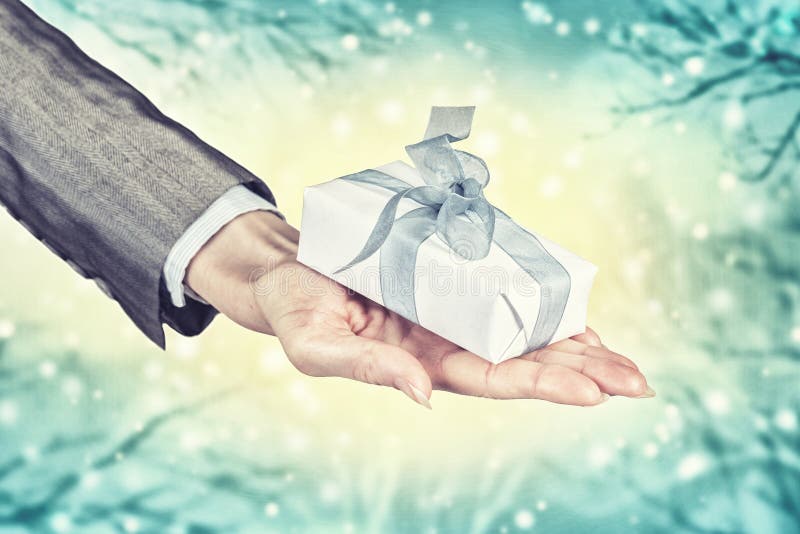 Man presenting his gift stock photo. Image of ribbon - 67415096