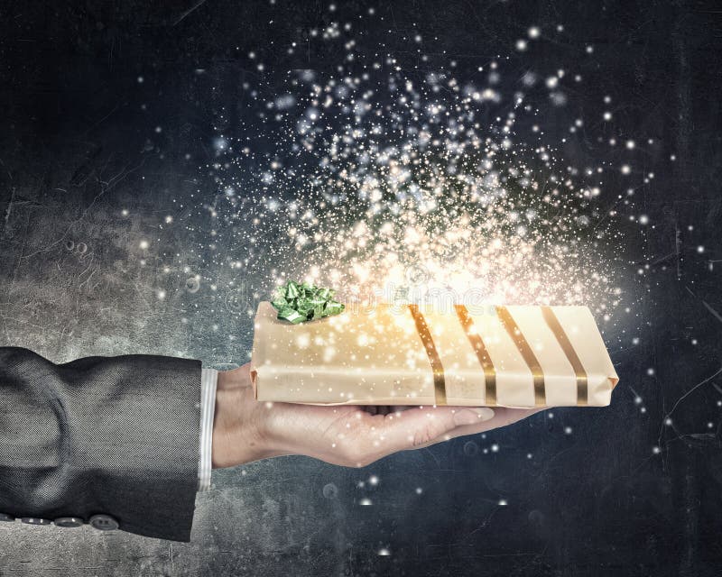 Man presenting his gift stock photo. Image of event, hold - 67457740
