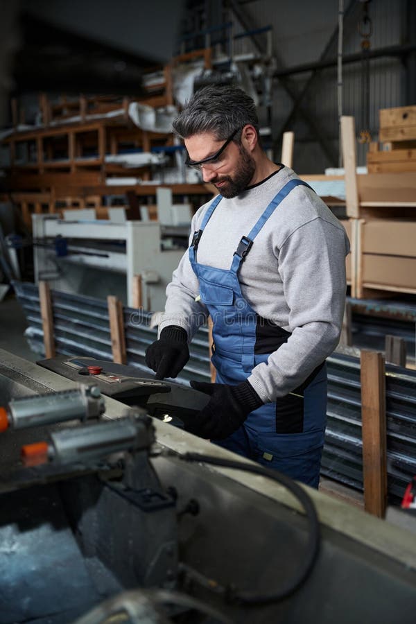 Man Presses Buttons on Remote Control of a Modern Machine Stock Photo ...