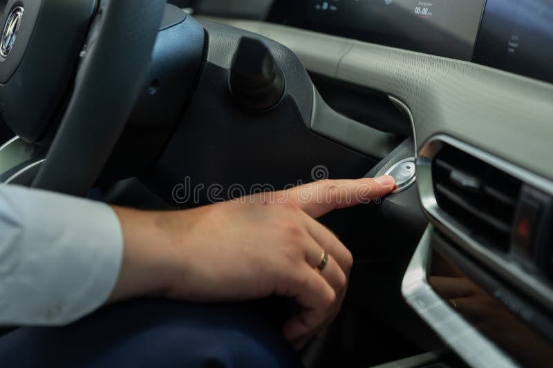 A Man Presses the Car Engine Start Button. Stock Photo - Image of ...