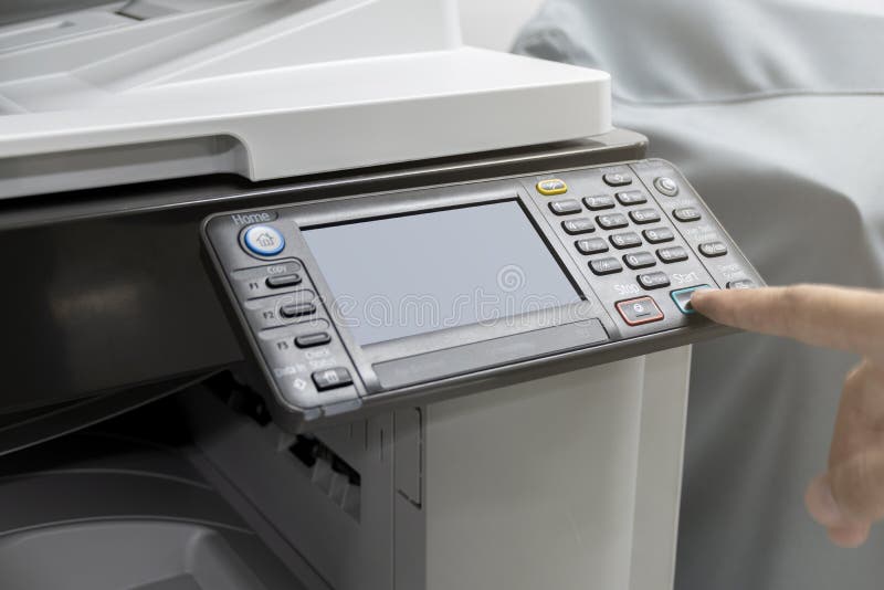 Man Pressing a Button To Start a Copy Machine Stock Photo - Image of ...
