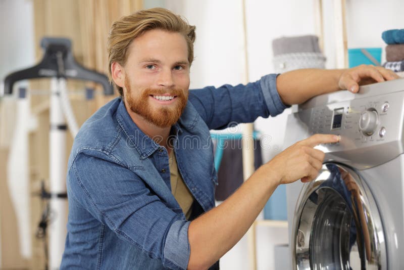 Man Pressing Button Start Washing Machine Stock Photos - Free & Royalty ...
