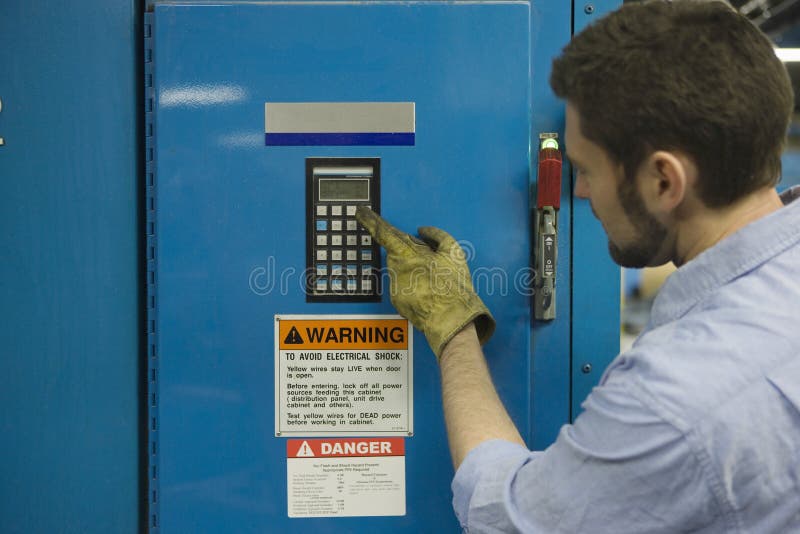 Man Pressing Keypad in Factory Stock Photo - Image of control, danger ...