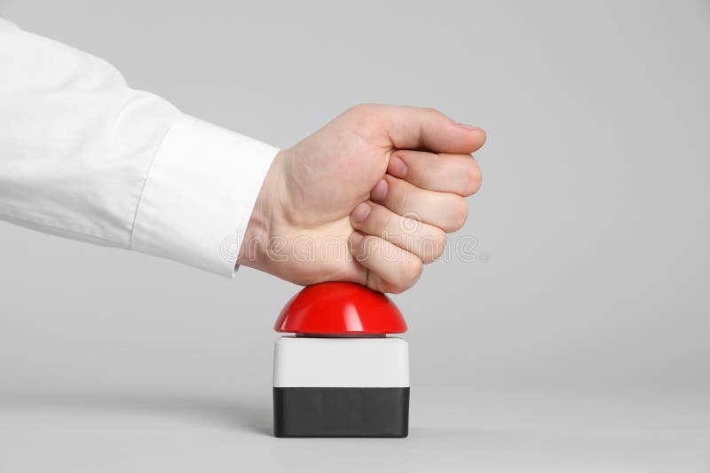 Man Pressing Red Button of Nuclear Weapon on Light Gray Background ...