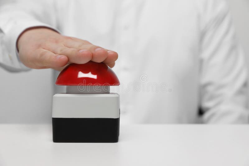 Man Pressing Red Button of Nuclear Weapon at White Table, Closeup with ...