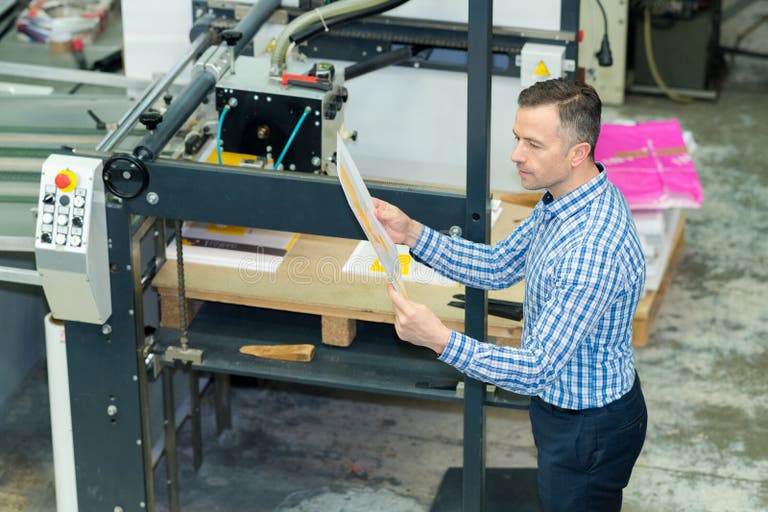 Man in printing factory stock photo. Image of technology - 277792214
