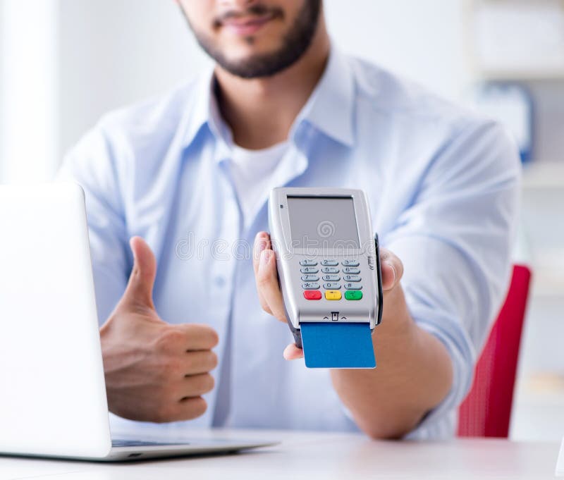 Man Processing Credit Card Transaction with POS Terminal Stock Image ...
