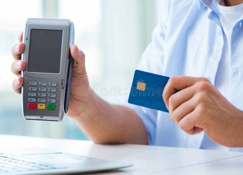 Man Processing Credit Card Transaction with POS Terminal Stock Image ...