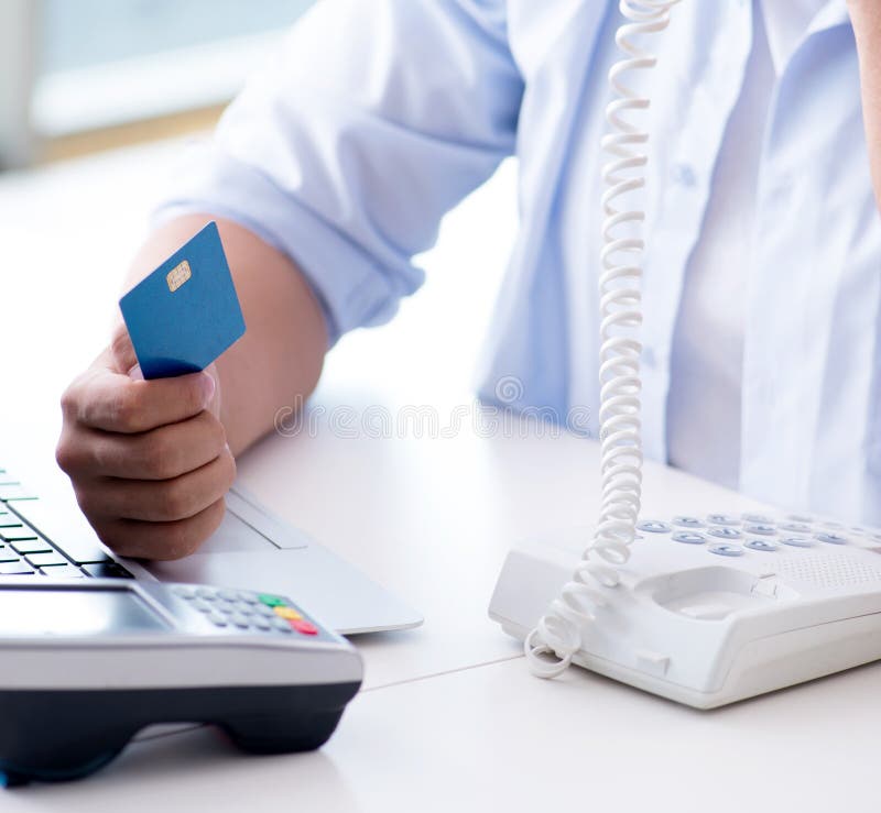 Man Processing Credit Card Transaction with POS Terminal Stock Photo ...