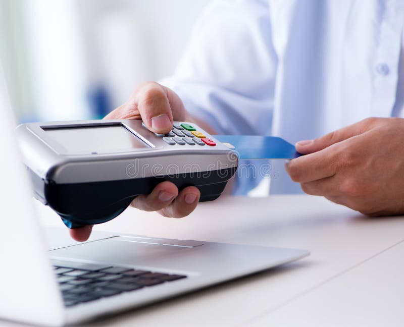 Man Processing Credit Card Transaction with POS Terminal Stock Image ...