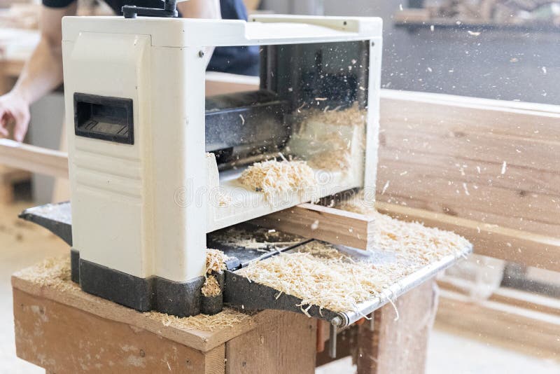 A Man is Processing a Tree. Joiner. a Carpenter. Woodworking Processes ...