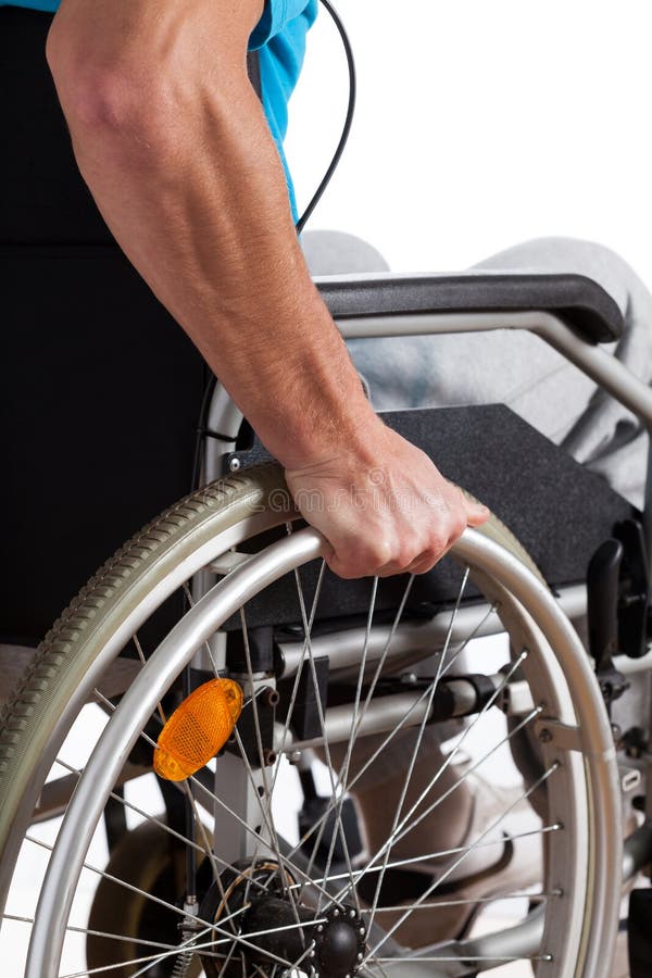 Man propelling wheelchair stock image. Image of handicap - 40161475
