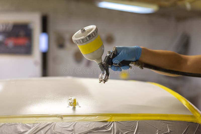 Man with Protective Clothes and Mask Painting Car Using Spray ...