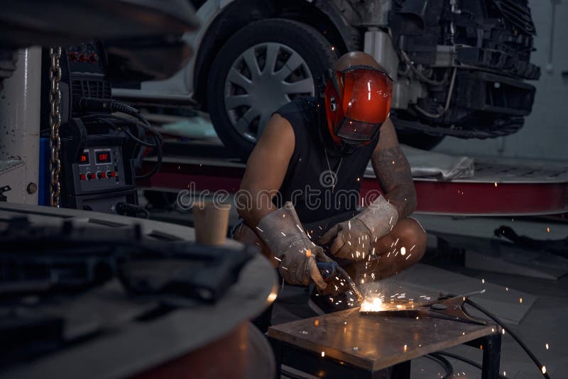 Man in Protective Face Mask and Gloves Using Welding Stock Image ...