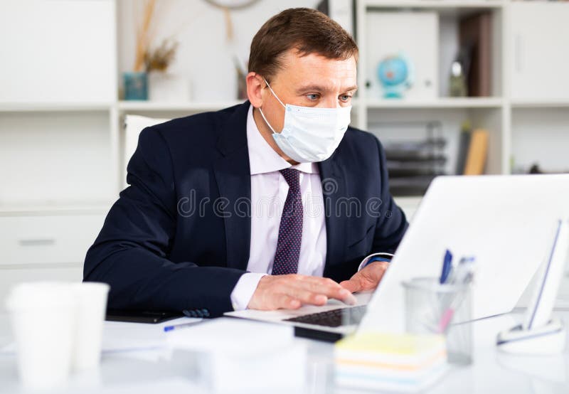Man in Protective Face Mask Working at Office Stock Photo - Image of ...