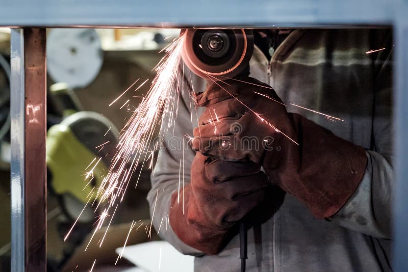 Man in Protective Gloves Cutting Metal Using Angle Grinder Making ...
