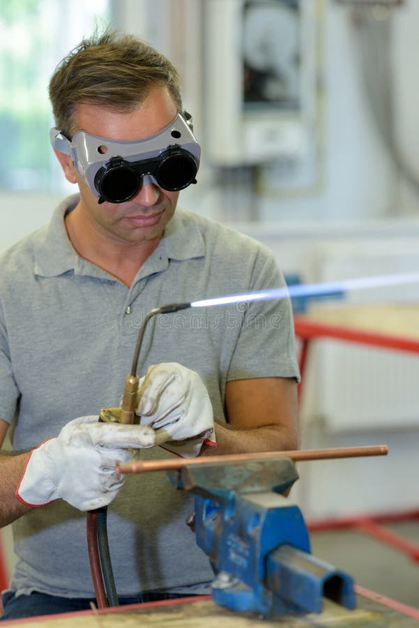 Man with Protective Goggles Welding in Factory Stock Image - Image of ...