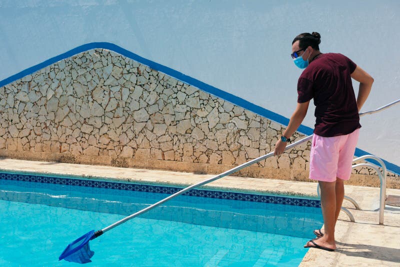 Man with Protective Mask Cleaning the Pool Stock Image - Image of pool ...