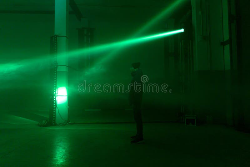 Man in Protective Mask Stand in Neon Light Garage. Stock Image - Image ...