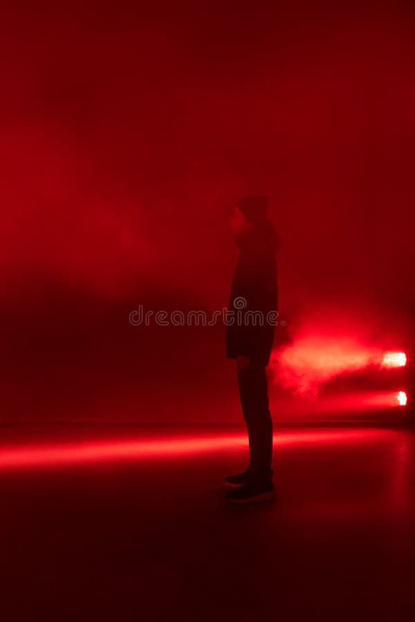Man in Protective Mask Stand in Neon Light Garage. Stock Image - Image ...