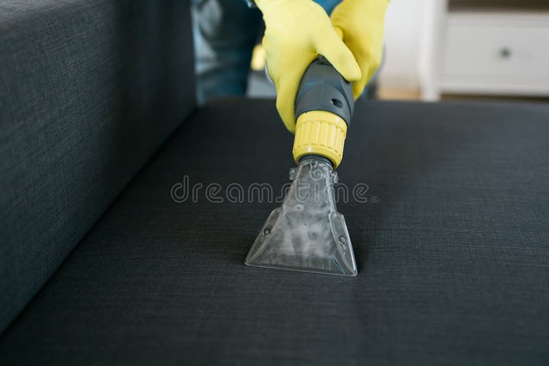 Man in Protective Rubber Glove Cleaning Sofa with Professionally ...