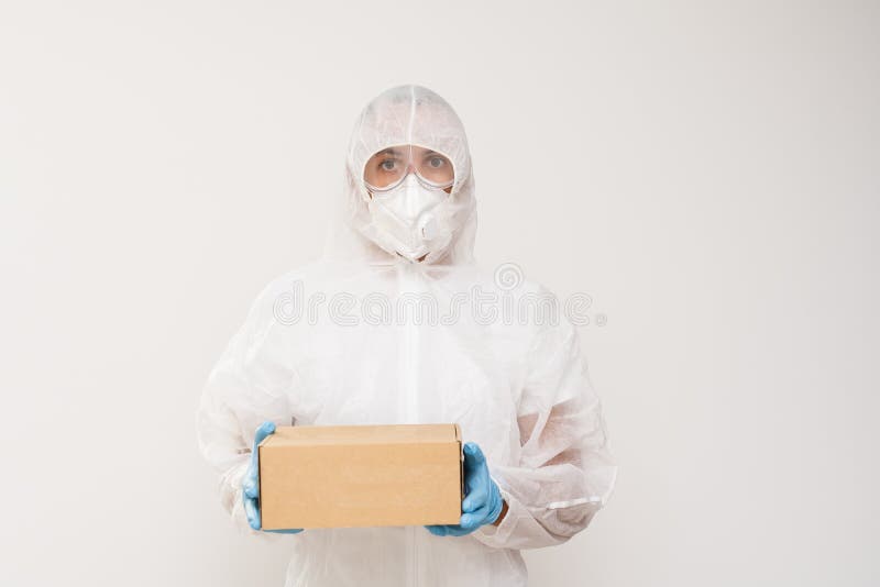 Man in Protective Suit and Mask with Box in His Hands Stock Image ...