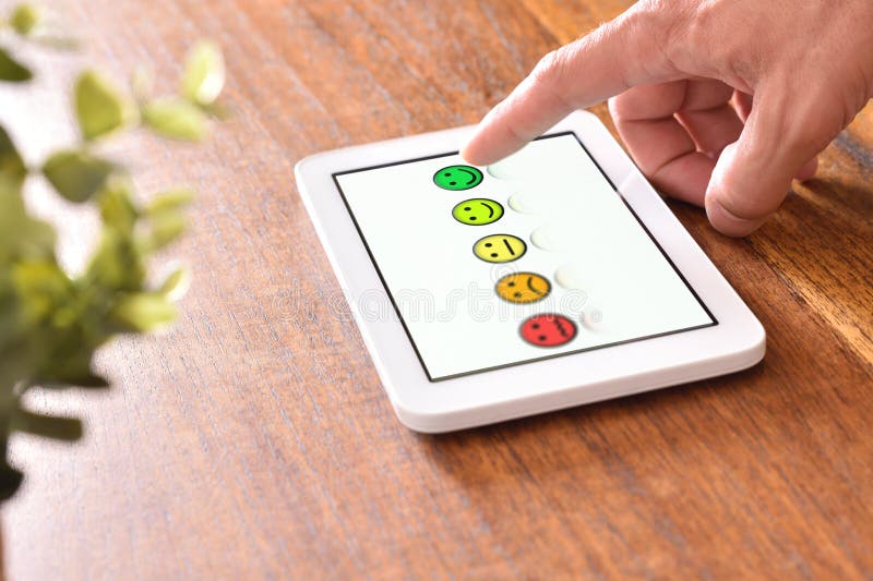 Man Providing a Assessment on an Electronic Device Stock Image - Image ...