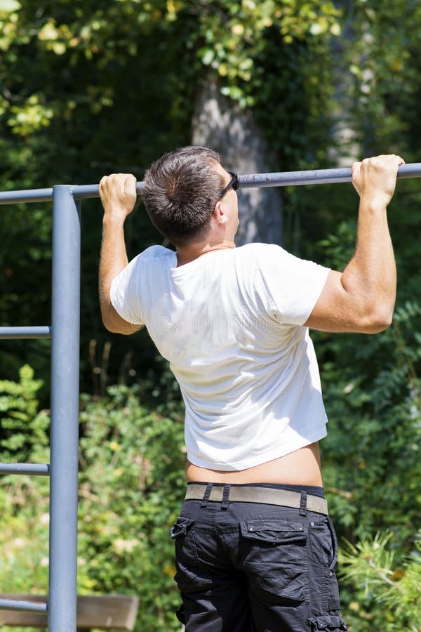 Man Pull Up In A Park.STREET WORKOUT Stock Image - Image of male ...