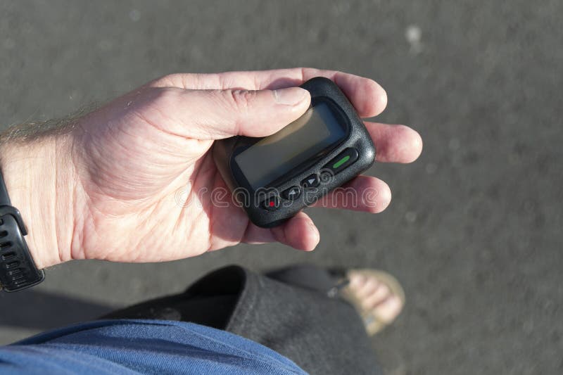 Man Pulled Out Pager with a Display from His Pocket on the Street Stock ...
