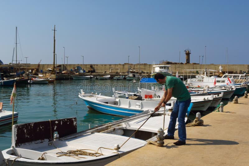 Man Pulling the Boat editorial stock image. Image of mature - 177717634