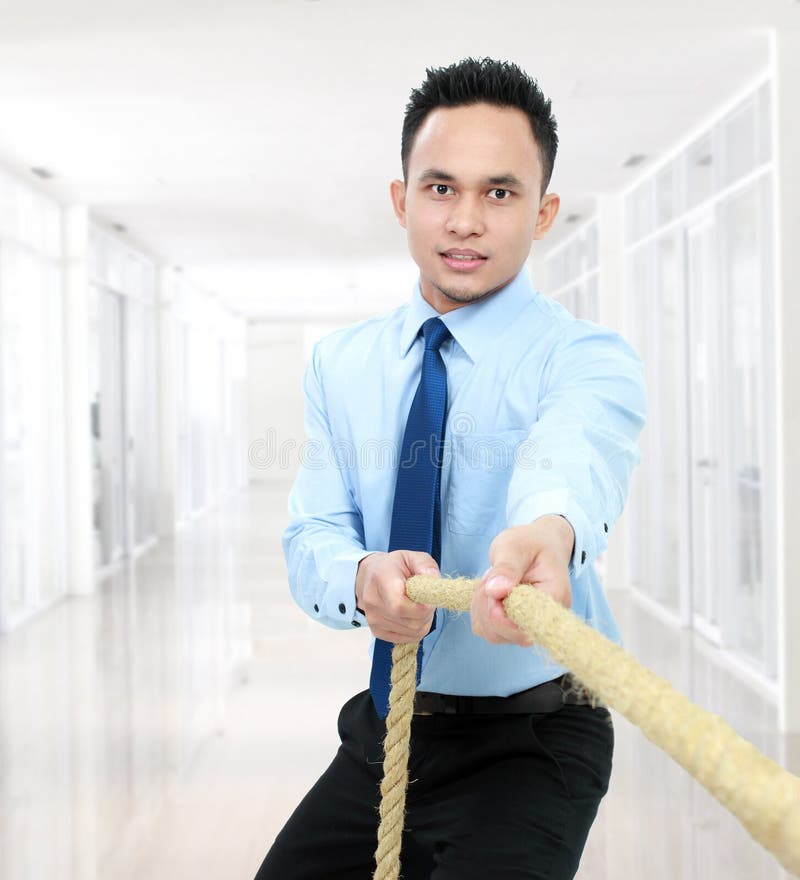 Man pulling a rope stock photo. Image of office, handsome - 28151290