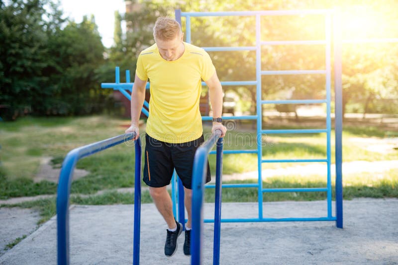 Man Pulling Up on Parallel Bars Stock Image - Image of pushing ...