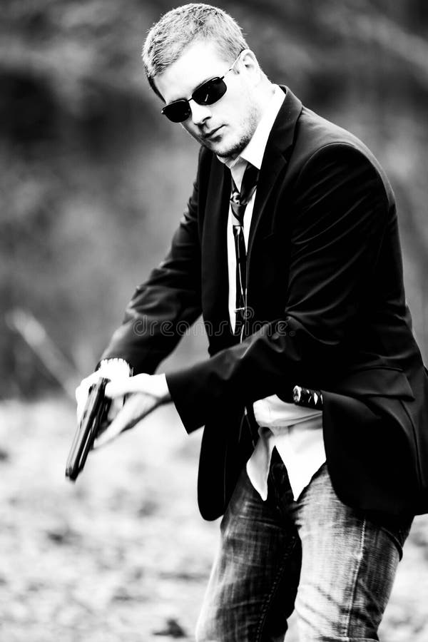 Man pulls a gun in car stock photo. Image of police, hands - 47134214