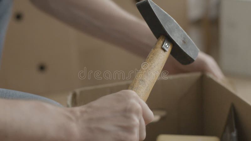 Man Pulls a Hammer Out of the Box. Man Doing Home Renovations and Pulls ...