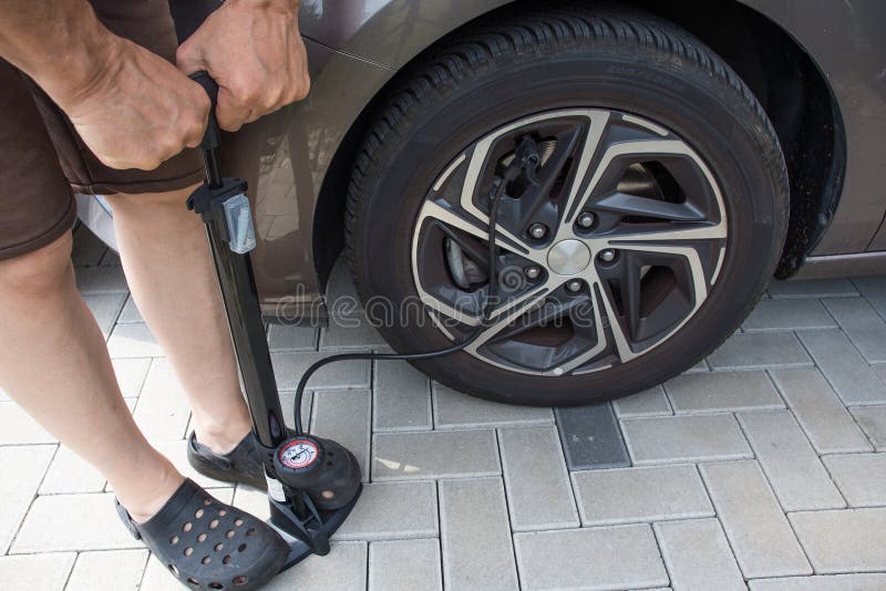 Man is Pumping the Car with Hand Pump Stock Image - Image of pumping ...