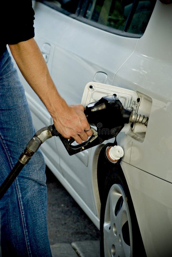 Man pumping gas into car stock photo. Image of caucasian - 3369914