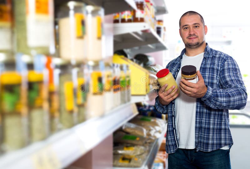 Man Purchasing Peanut Butter in Grocery Stock Image - Image of male ...