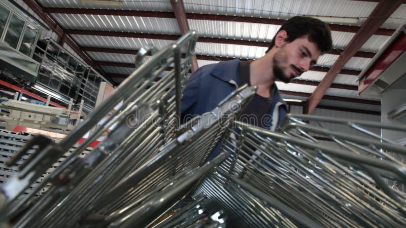 Man Pushing Cart in Warehouse Stock Video - Video of parts, young: 70871037