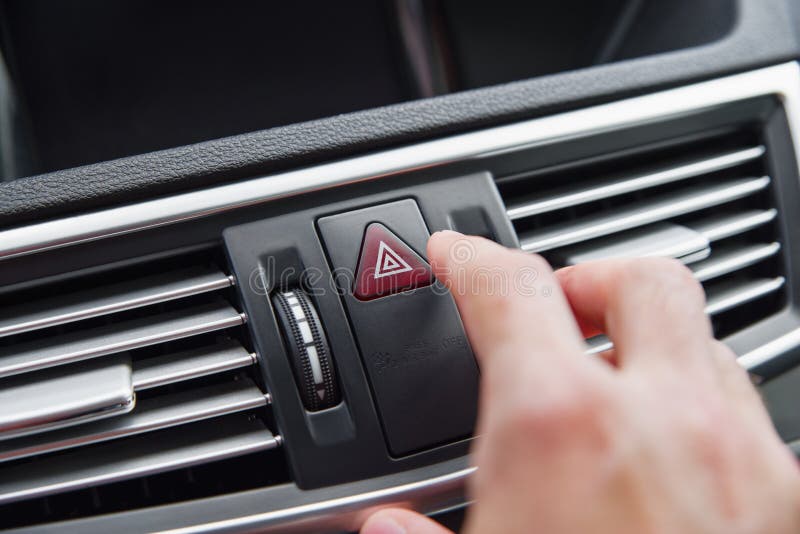 Man Pushing Emergency Light Button while Driving Car Stock Photo ...