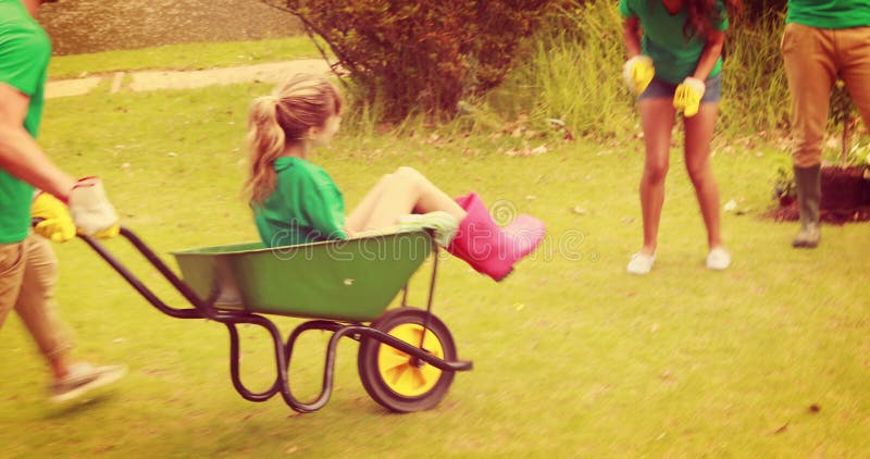 Man Pushing His Friend in Wheelbarrow with Friends Behind Stock Video ... Man Pushing His Friend in Wheelbarrow with Friends Behind Stock Video ...