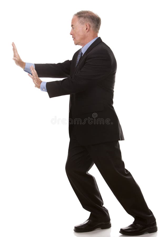 Man pushing an object stock photo. Image of portrait - 26957166