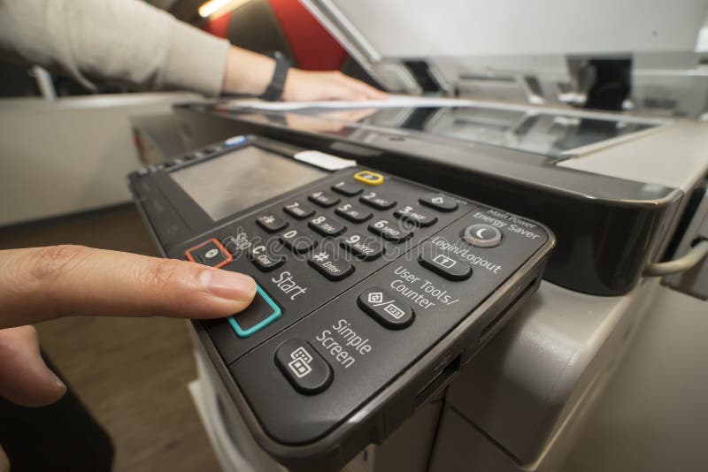 Man Pushing the Start Button of Photocopy Equipment for Document ...