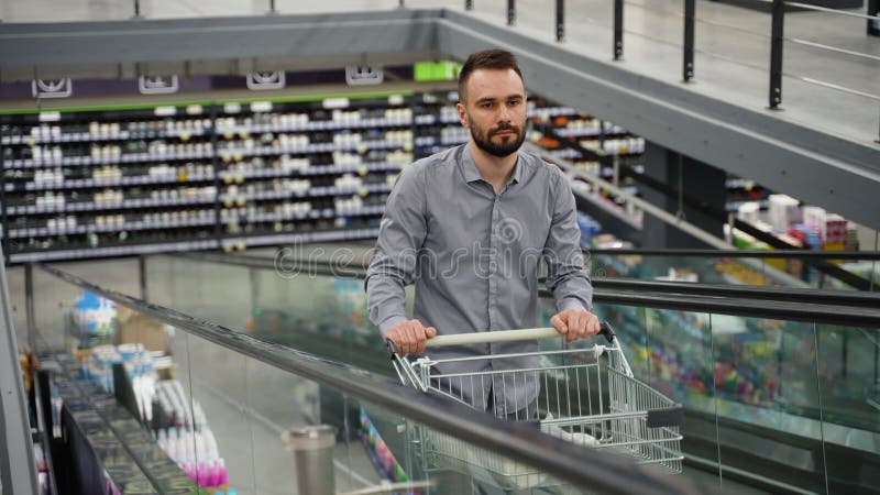 A Man Pushing Trolley on Escalator in Hardware Store Stock Footage ...