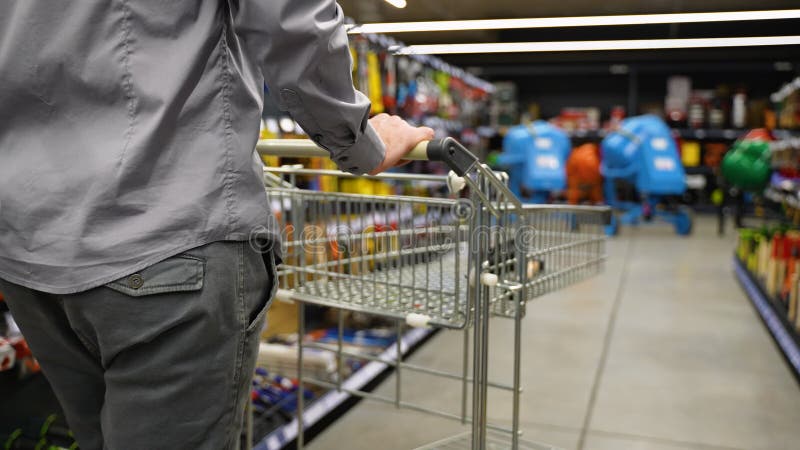 A Man Pushing Trolley in Hardware Store Stock Video - Video of hardware ...