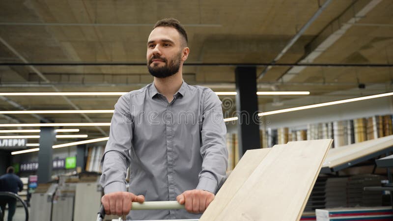 A Man Pushing Trolley with New Laminate in Hardware Store Stock Video ...